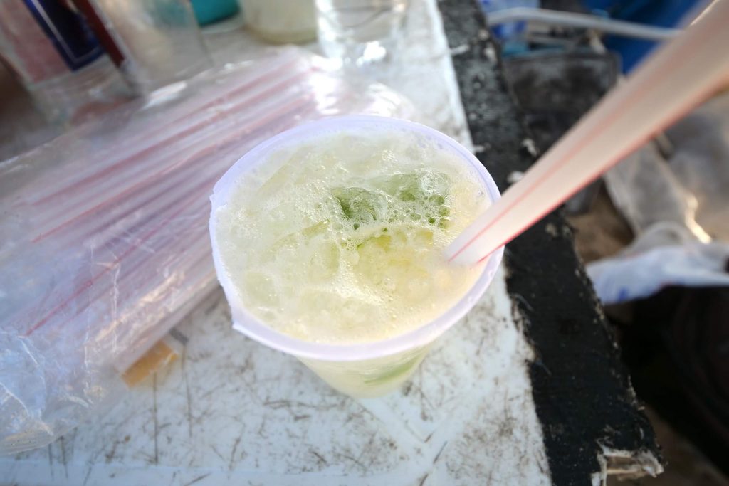 Sugar Cane Alcohol and Lime over Ice on Copacabana Beach